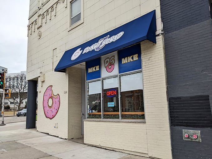 That iconic blue awning and pink donut logo beckon like an old friend. Step inside and prepare for some serious decision-making dilemmas.