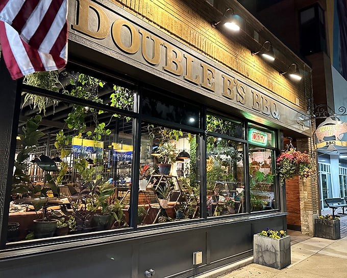 By night, Double B's transforms into a plant-filled oasis where barbecue dreams come true under warm golden lighting.