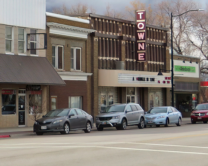 Classic theater marquees remind us when entertainment meant gathering together, not scrolling alone.