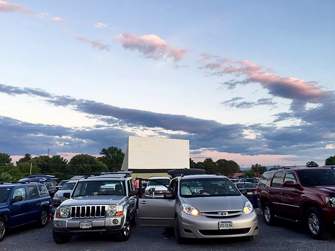 The perfect summer night: a sea of cars, a giant screen, and a sky painted with sunset colors at Family Drive-In.