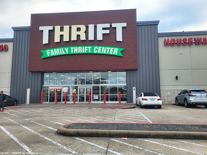 The red bollards stand guard like friendly sentries, welcoming shoppers to Houston's sprawling temple of secondhand splendor and endless aisles.