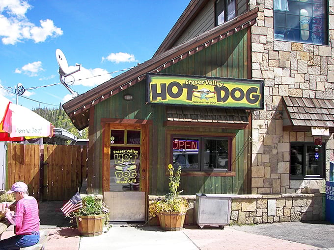 That bright yellow "HOT DOG" sign isn't just advertising &ndash; it's a beacon of hope for hungry hikers and skiers in Winter Park.