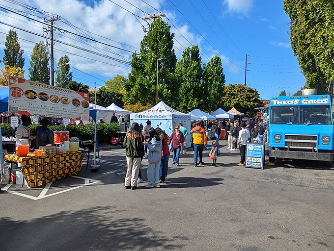 Food trucks and vendor stalls create a vibrant marketplace atmosphere. The perfect Sunday morning adventure for both serious shoppers and casual browsers.