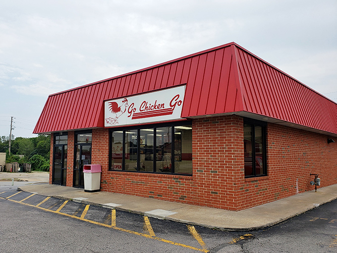 This unassuming brick building houses chicken magic that locals have treasured for years. Red roof, golden chicken&mdash;perfect equation.
