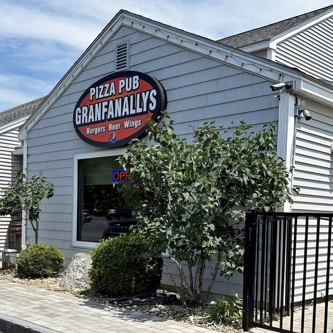 That classic neighborhood pizza joint exterior promises comfort food magic waiting just inside the door.