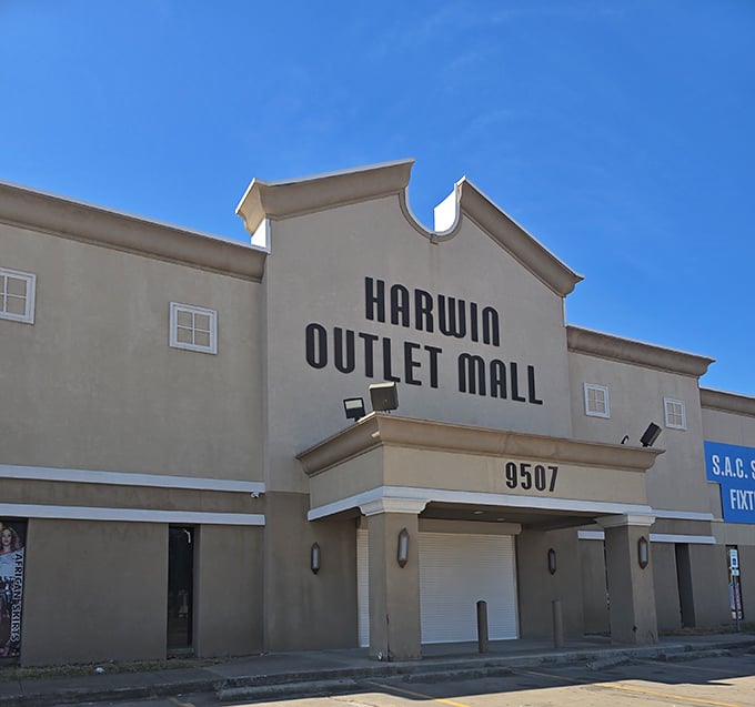 Under that perfect Texas blue sky, Harwin Outlet Mall stands ready to welcome another day of serious shopping adventures.