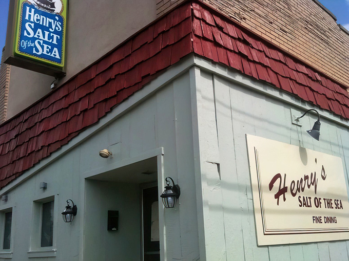 The red-shingled roof and weathered sign promise old-school seafood magic without any fancy pretensions.