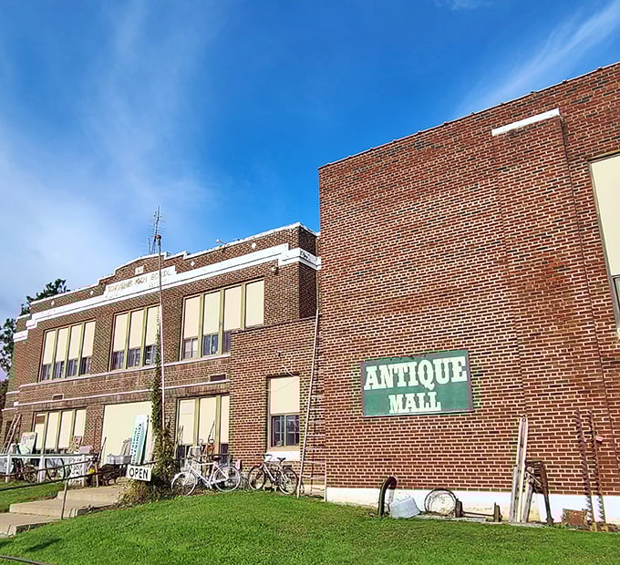 The sign says "Antique Mall," but the building whispers "I've got stories to tell." A classic Wisconsin repurposing at its finest.