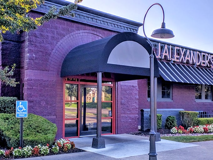 Those striped awnings and arched entrance say "fancy" but the parking lot says "come as you are."