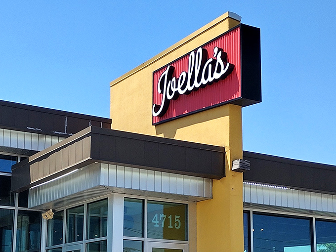 The bold red-and-yellow signage of Joella's stands out like a beacon for fried chicken pilgrims seeking crispy salvation.