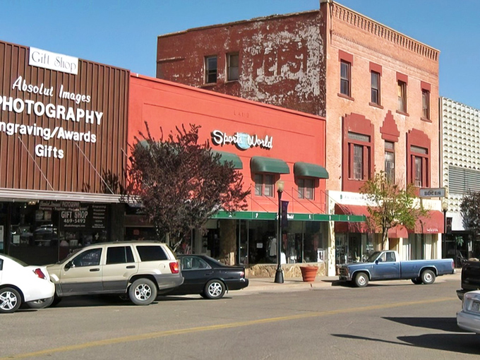 Those green awnings and vintage storefronts tell you everything about small-town prices before you even walk inside.