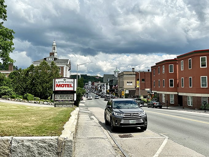 The Littleton Motel sign stands sentinel against a backdrop of mountains that seem to whisper, "Stay awhile, the scenery gets better."
