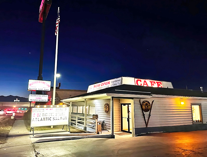 Night falls, but hunger rises! The Midvale Mining Cafe's illuminated sign serves as a beacon for late-night comfort food seekers.