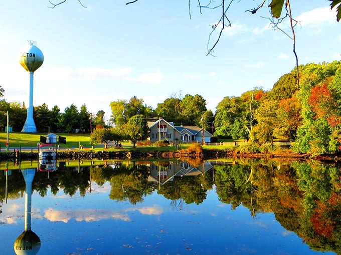 That blue water tower isn't just storing water&mdash;it's storing small-town memories against a backdrop of autumn's finest performance.