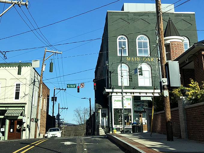 Small-town charm flows downhill like morning coffee, warming hearts on every corner. 