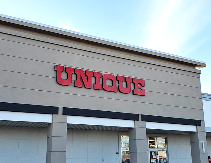 The clean storefront hides thousands of treasures inside, where your next favorite outfit waits patiently on a rack.