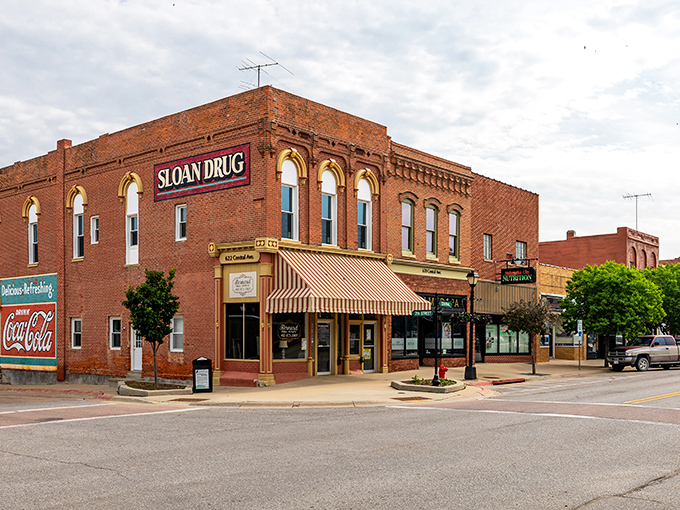 Brick by glorious brick! Sloan Drug stands sentinel at this Nebraska City crossroads, where Coca-Cola memories flow as refreshingly as small-town gossip.