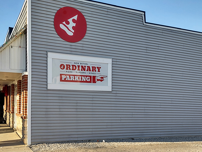 That red pizza slice logo promises what awaits inside: simple surroundings, extraordinary flavors that'll make you forget fancy dining exists.