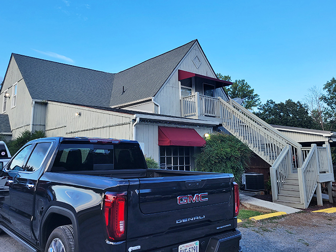 Those stairs lead to steak heaven! New London's charming farmhouse vibe promises comfort food that hugs your soul.