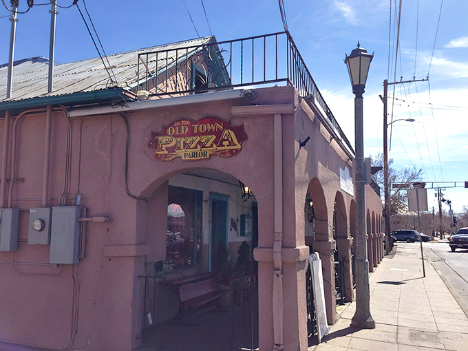 Where history and hunger meet! The pink adobe fa&ccedil;ade of Old Town Pizza Parlor beckons with promises of cheesy delights inside.