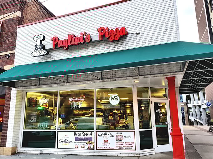 That iconic red Pagliai's sign promises pizza perfection inside &ndash; like spotting an old friend waving you over for dinner.