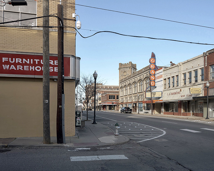 That vintage Grand Theater sign isn't just decoration&mdash;it's a reminder that entertainment used to be a community event, not a solitary scroll.