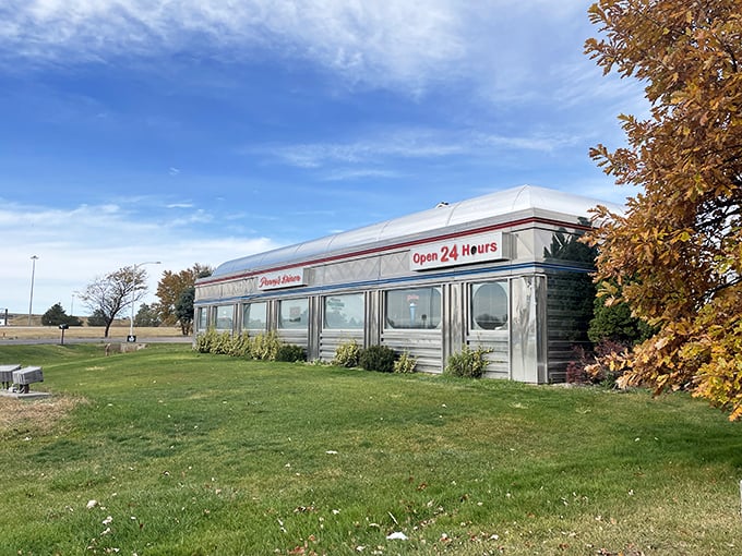 This gleaming roadside time machine promises pancakes at midnight and memories that last longer than your coffee refills.