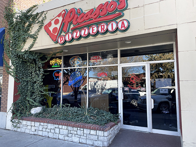 Where pizza meets art! Picasso's charming storefront with its ivy-covered brick hints at the creative culinary canvas inside.