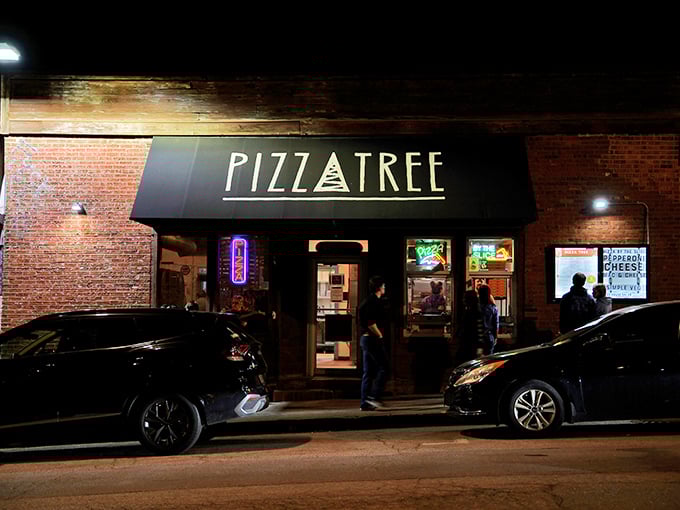 When darkness falls, Pizza Tree glows like a beacon calling hungry souls home.