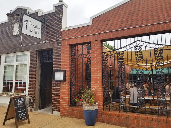 A neighborhood gem hiding in plain sight. This cozy corner of The Hill promises wood-fired magic behind those ornate gates.