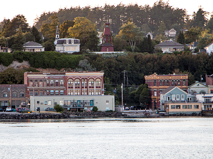 Where historic brick buildings stand like proud sentinels, watching over a harbor that's seen centuries of stories.