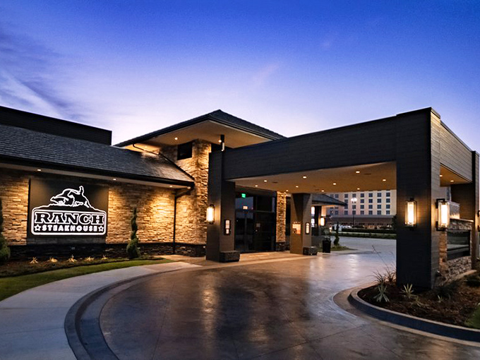 Ranch Steakhouse's elegant entrance at dusk &ndash; where the neon glow promises a carnivore's paradise within.