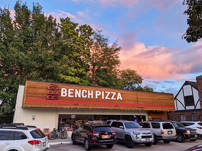 Red Bench Pizza's wooden storefront beckons pizza lovers like a siren call to carb-craving sailors.
