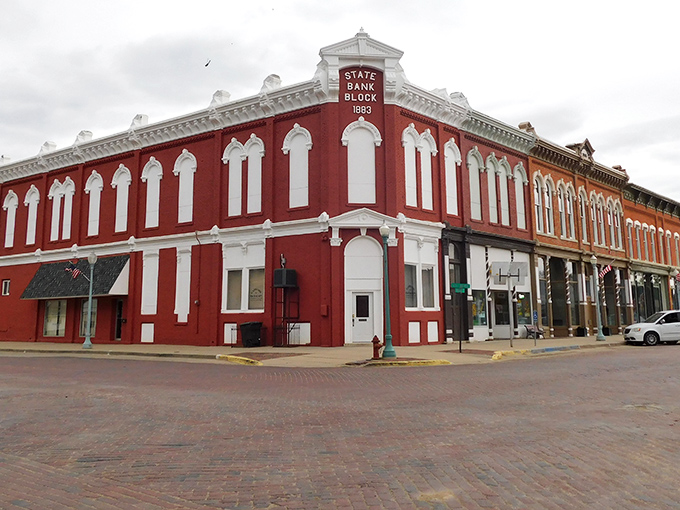 This brick beauty stands as Red Cloud's crown jewel, where small-town banking met big-city architecture dreams.