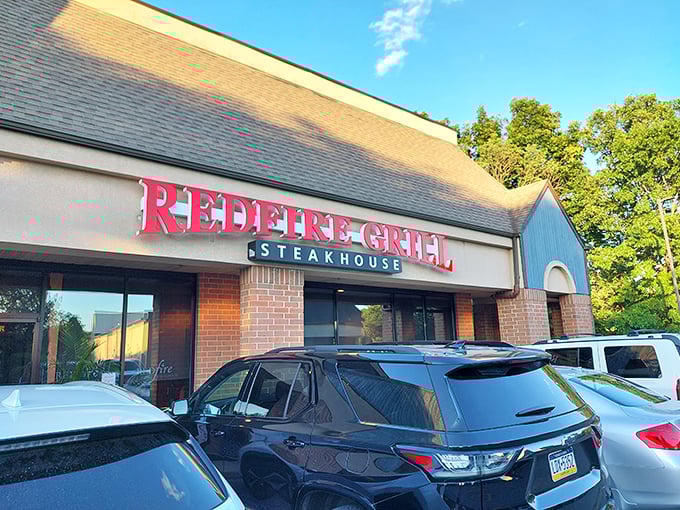 Under the afternoon sun, RedFire Grill&rsquo;s bold red sign makes a promise few can resist &mdash; steaks worth stopping for.
