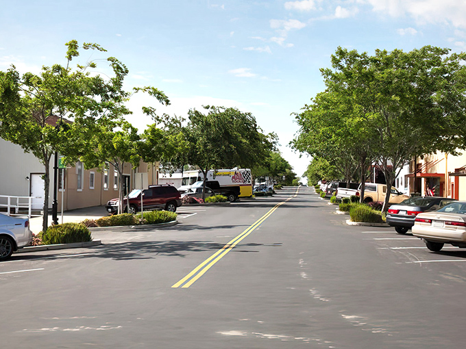 Main Street's green sentinels stand guard over Rio Vista's sun-drenched thoroughfare&mdash;a Norman Rockwell painting with parking spaces and pickup trucks.