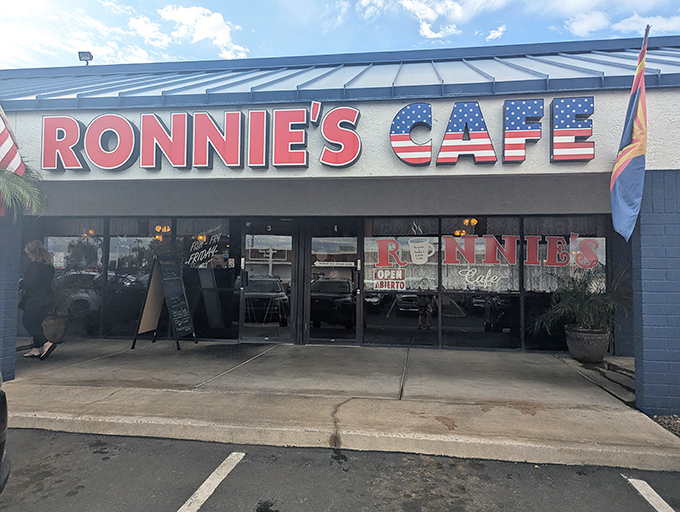 The red, white, and blue signage at Ronnie's Cafe promises classic American breakfast in a no-frills setting that feels like coming home.