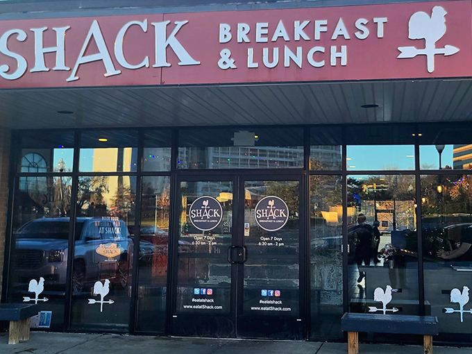 Glass doors reveal the warm glow inside, where morning magic happens one perfectly cooked egg at a time.