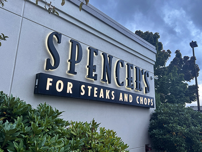 That classic steakhouse sign promises serious business inside - no fancy frills, just perfectly grilled perfection.