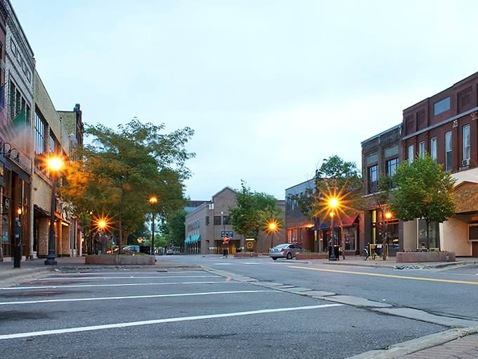 Evening lights illuminate St. Cloud's charming downtown, where affordable dining and shopping await your exploration.