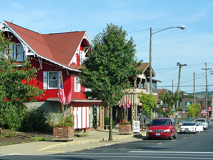 That red house isn't just eye-catching&mdash;it's practically waving hello! Sugarcreek's streets feel like a warm hug for your wallet.