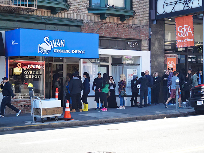 The blue awning beckons like a lighthouse for seafood lovers, promising treasures from the deep inside this tiny temple.