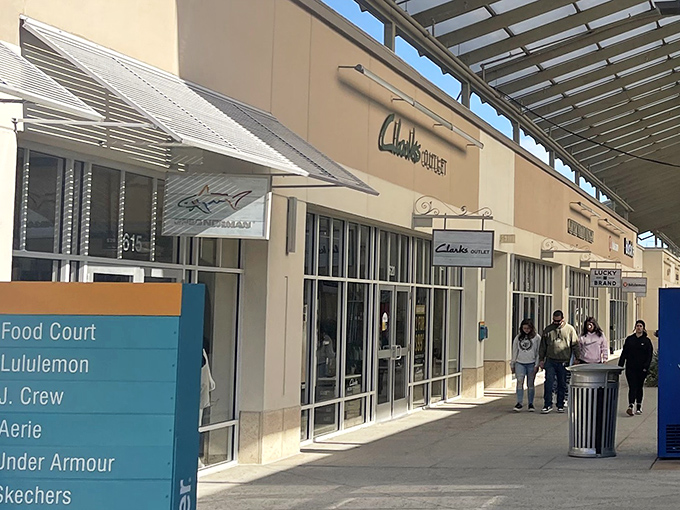 Modern storefronts blend seamlessly with tropical landscaping, making every shopping trip feel like a mini getaway.