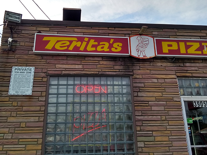Terita's Pizza: That neon "OPEN" sign is like a beacon of hope for anyone craving old-school Columbus-style pizza done right.
