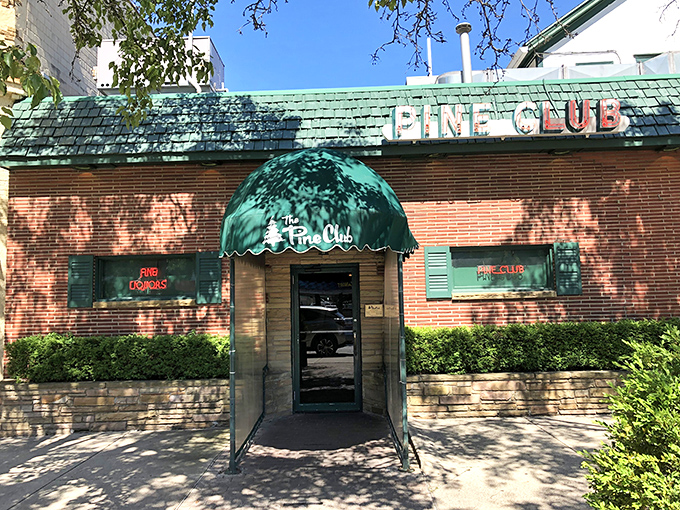 Step through these doors and enter steak paradise. The Pine Club's entrance promises old-school charm and perfectly aged beef inside.