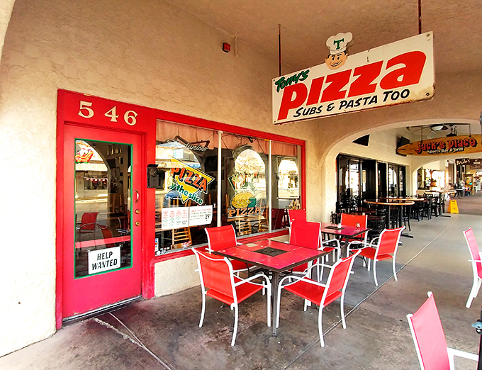 Those red outdoor tables aren't just seating&mdash;they're front-row tickets to Boulder City's best pizza show.