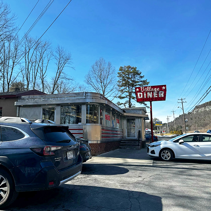 Winter or summer, that iconic red Village Diner sign has been guiding hungry travelers to this chrome beauty for decades. Some landmarks never lose their shine!