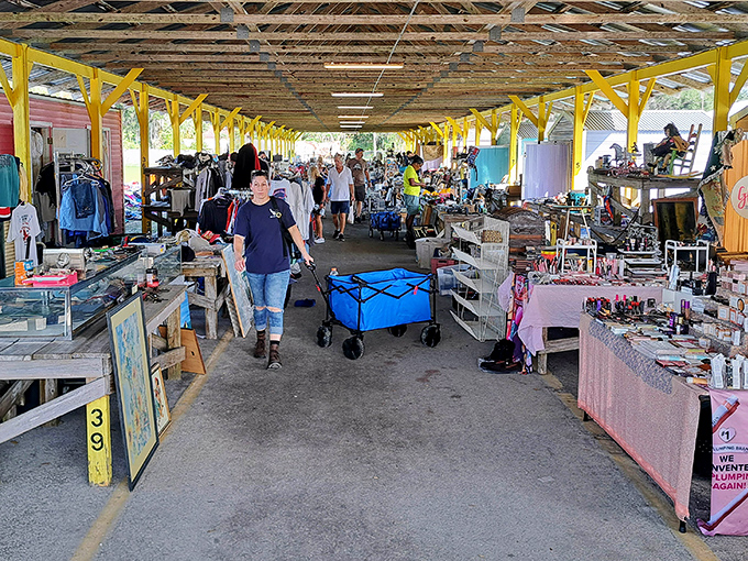 Under these yellow beams, shoppers wheel their finds through a wonderland of possibilities and potential heirlooms.