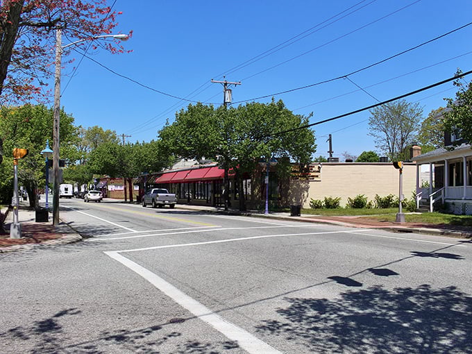 Small-town commerce, Rhode Island style! This corner has probably witnessed more neighborhood gossip than a season finale of "The Golden Girls."