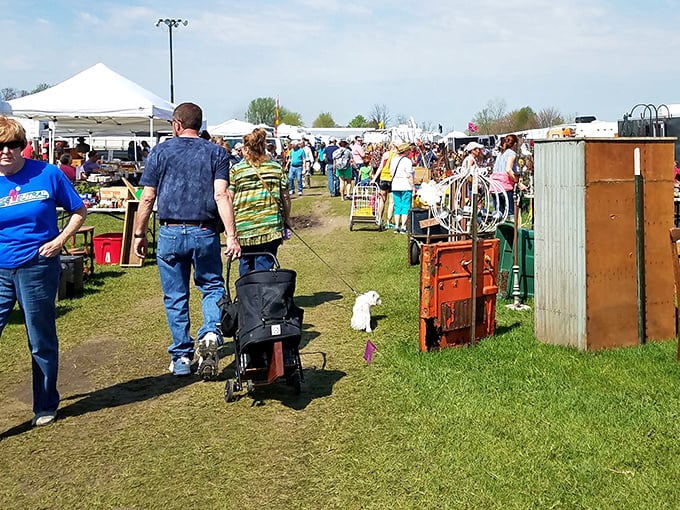 The thrill of the hunt in action! Shoppers navigate a sea of possibilities at What Cheer, where every table holds potential discoveries.